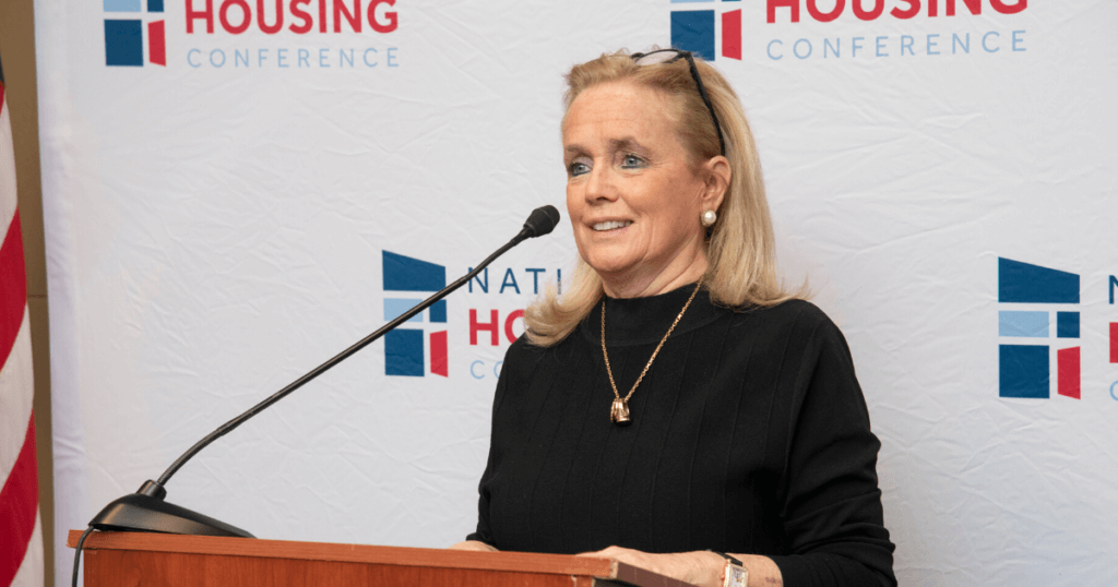 Rep. Debbie Dingell (D-Mich.) addresses housers at NHC’s Advocacy Day